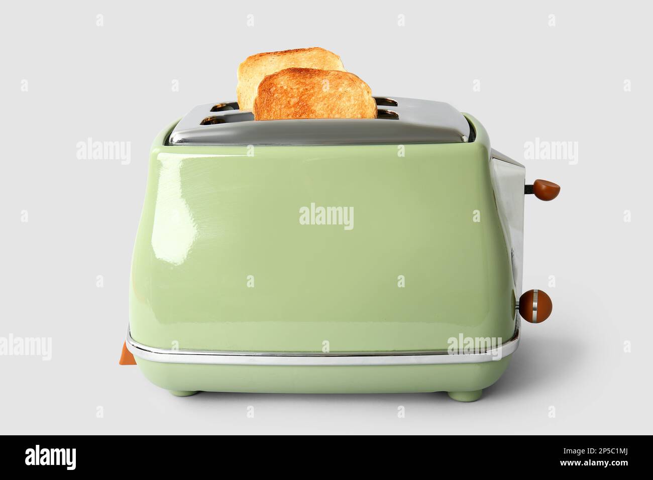 Modern toaster with crispy bread slices isolated on white background ...