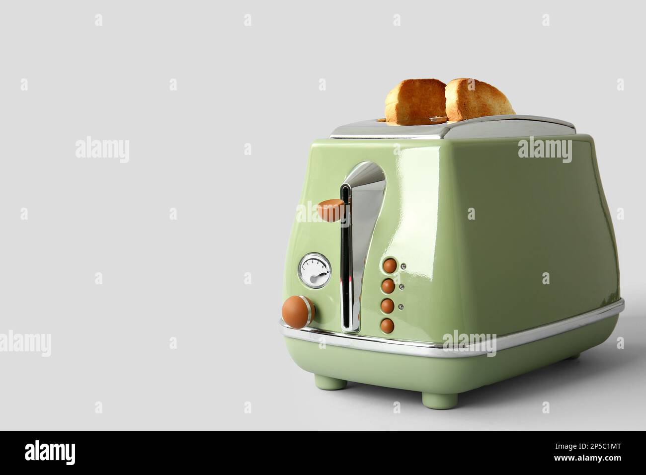 Modern toaster with crispy bread slices isolated on white background Stock Photo - Alamy
