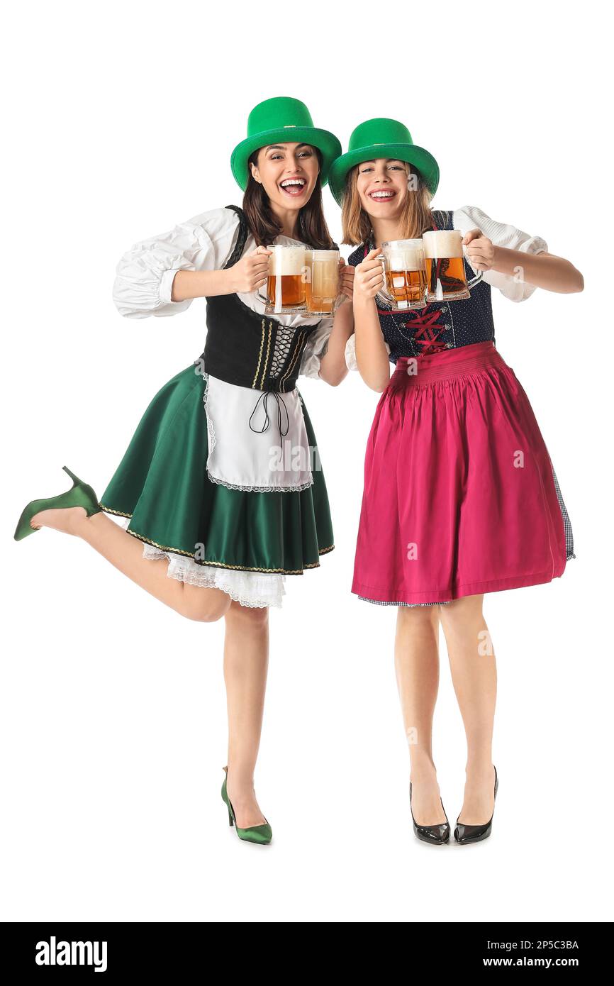 Irish waitresses with glasses of beer on white background. St. Patrick ...
