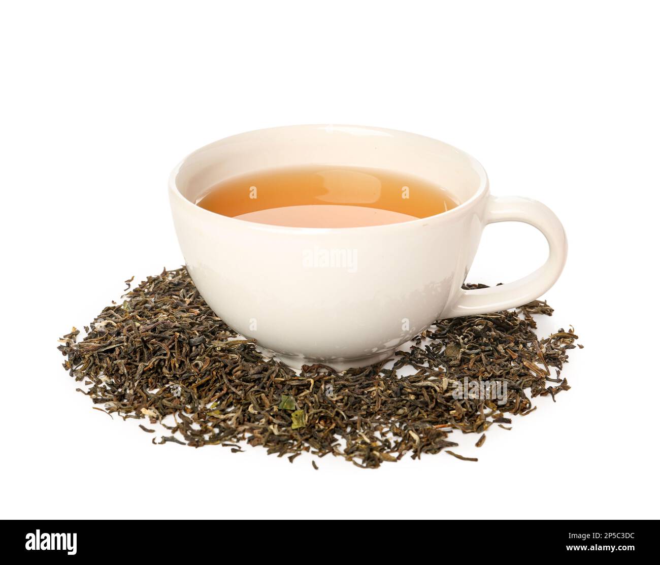 Cup of hot green tea and dry leaves on white background Stock Photo - Alamy