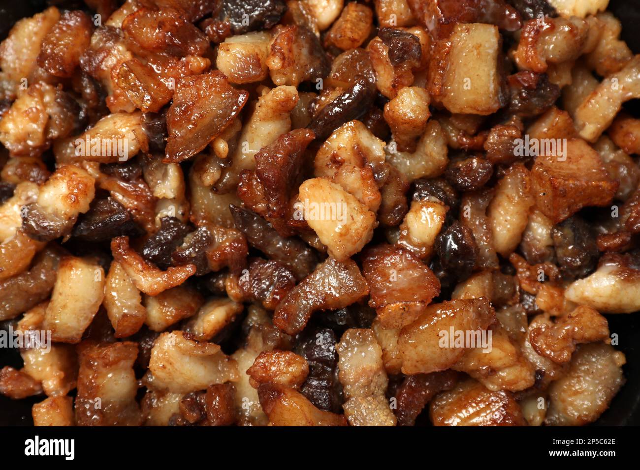 Tasty fried cracklings as background, top view. Cooked pork lard Stock ...