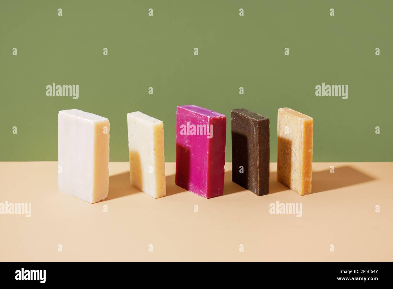 Set of natural soap bars on color table Stock Photo - Alamy