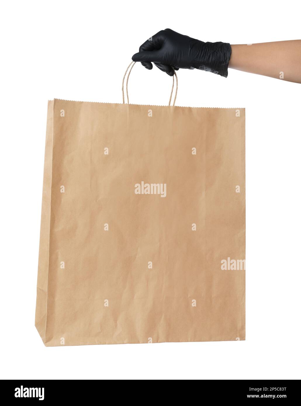 Woman holding shopping paper bag on white background Stock Photo - Alamy