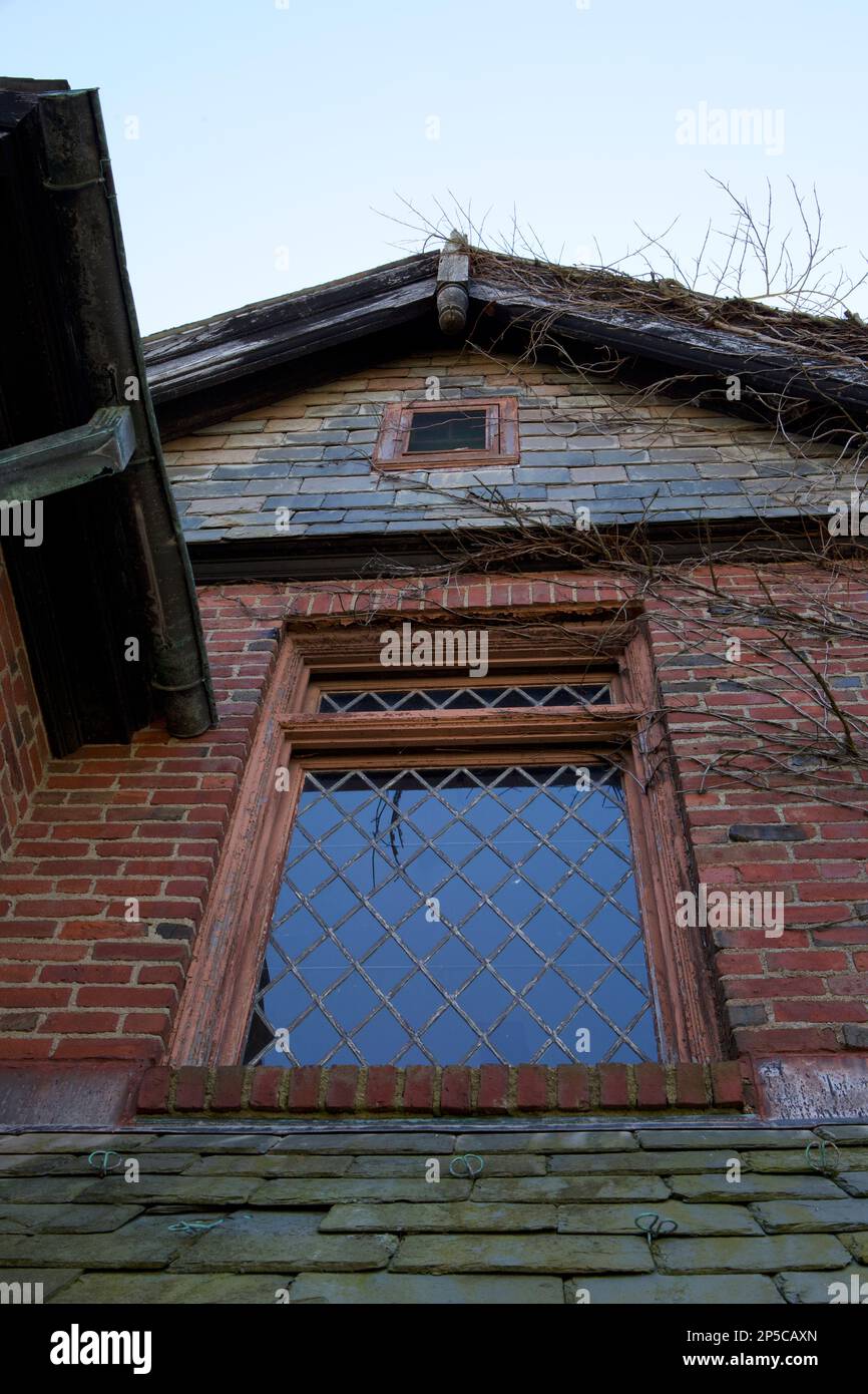 View of old building on the second story, showing slate siding, red ...