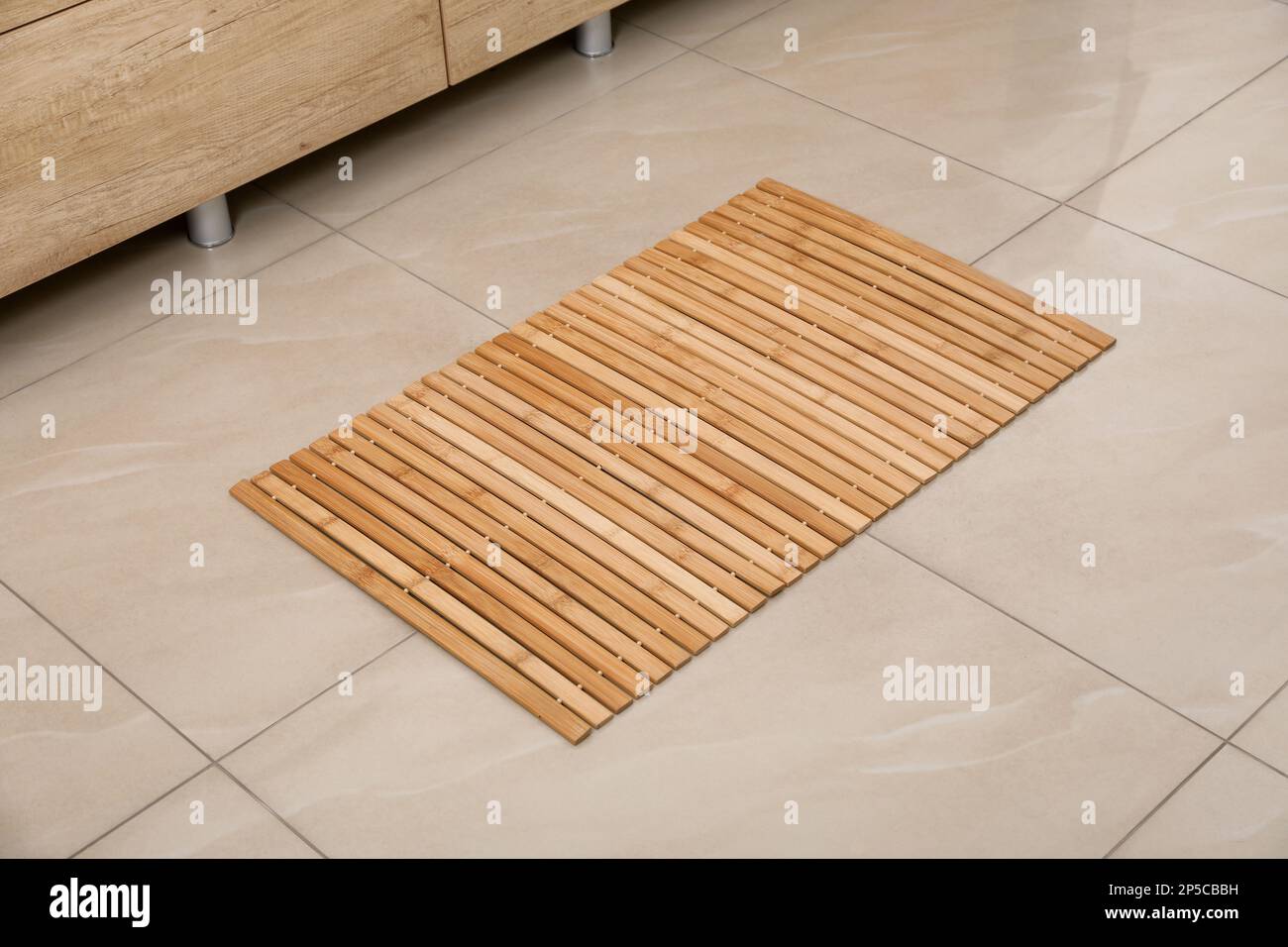 Wooden mat on floor in bathroom. Interior design Stock Photo - Alamy