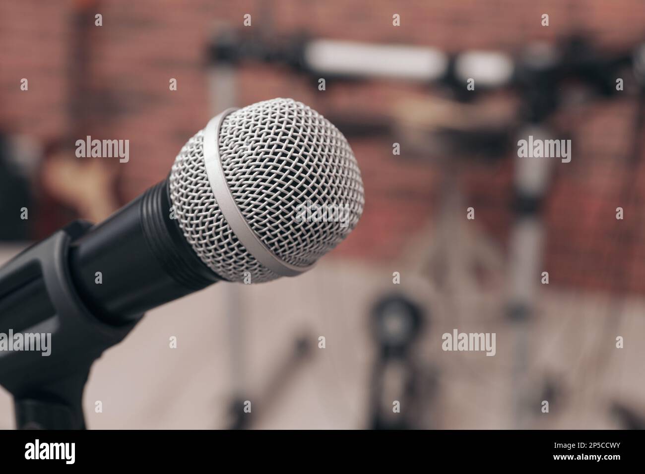 Modern microphone on blurred background, closeup. Space for text Stock ...