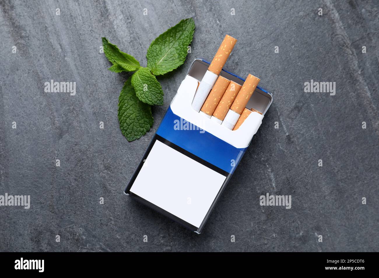 Pack of menthol cigarettes and mint on grey table, flat lay Stock Photo ...