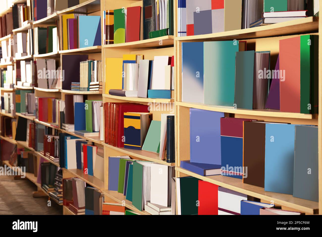 Collection of different books on shelves in library Stock Photo - Alamy