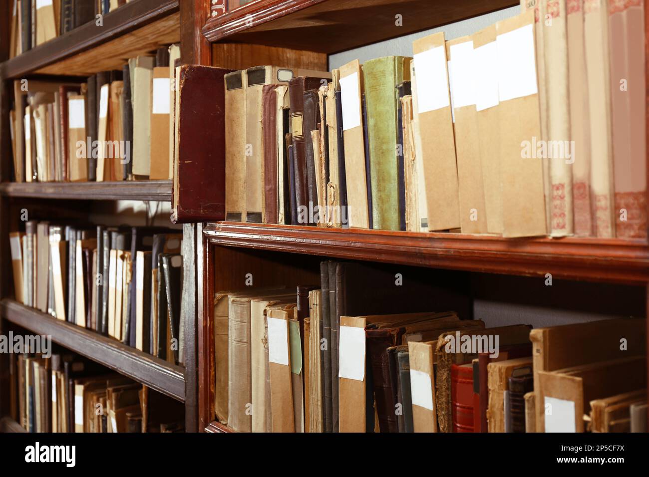 Collection of different books on shelves in library Stock Photo - Alamy