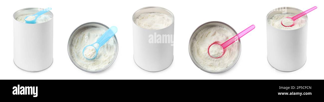 Set with cans of powdered infant formula with scoops on white ...