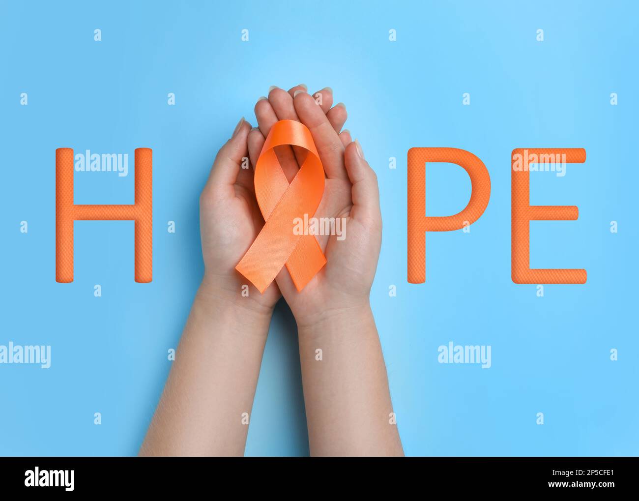 Word HOPE and woman with orange awareness ribbon on light blue ...