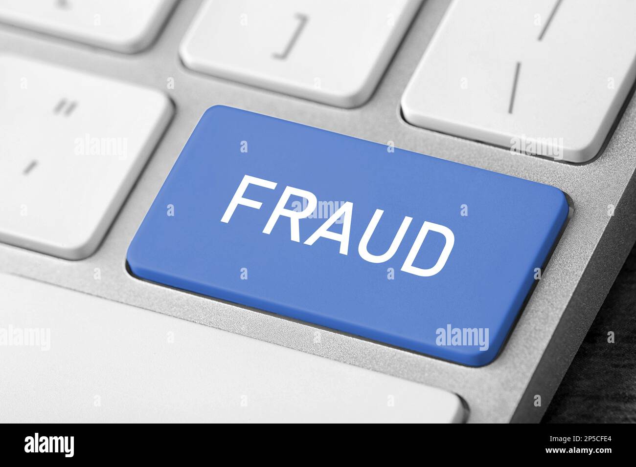 Blue button with word FRAUD on keyboard, closeup view Stock Photo - Alamy