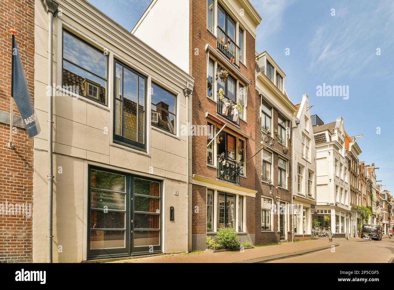 Amsterdam, Netherlands - 10 April, 2021: a city street with buildings ...