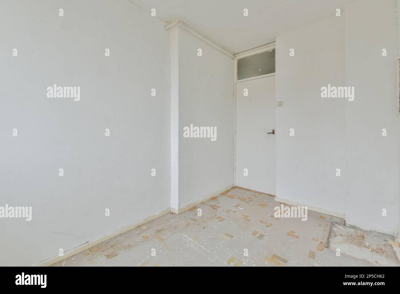 an unfinished room with white walls and dry plaster on the wall is ...
