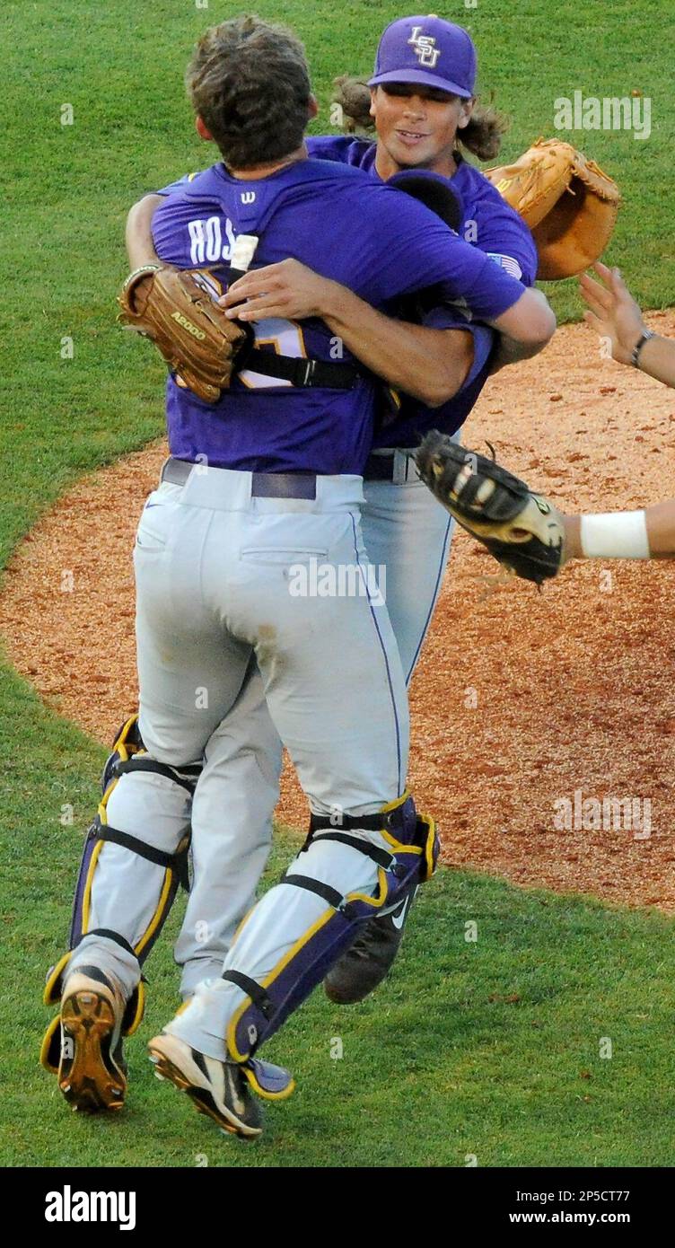 LSU catcher Ty Ross hugs relief pitcher Chris Cotton after LSU defeated ...