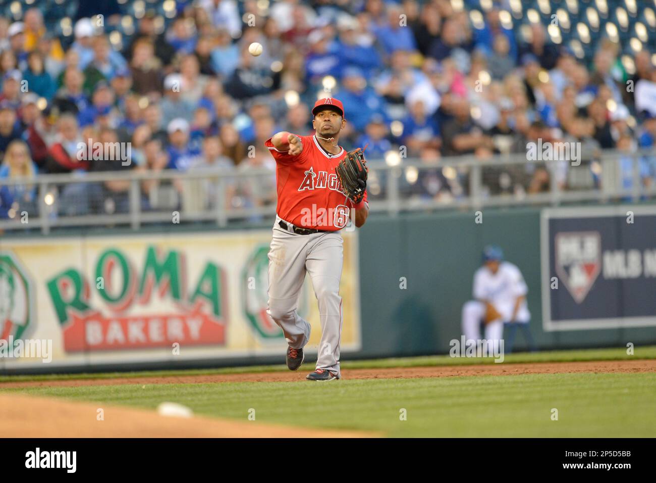 Los Angeles Angels third baseman Alberto Callaspo throws to first base ...