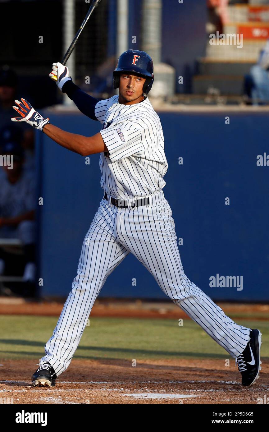 Carlos Lopez #17 of the Cal State Fullerton Titans bats against the UC ...