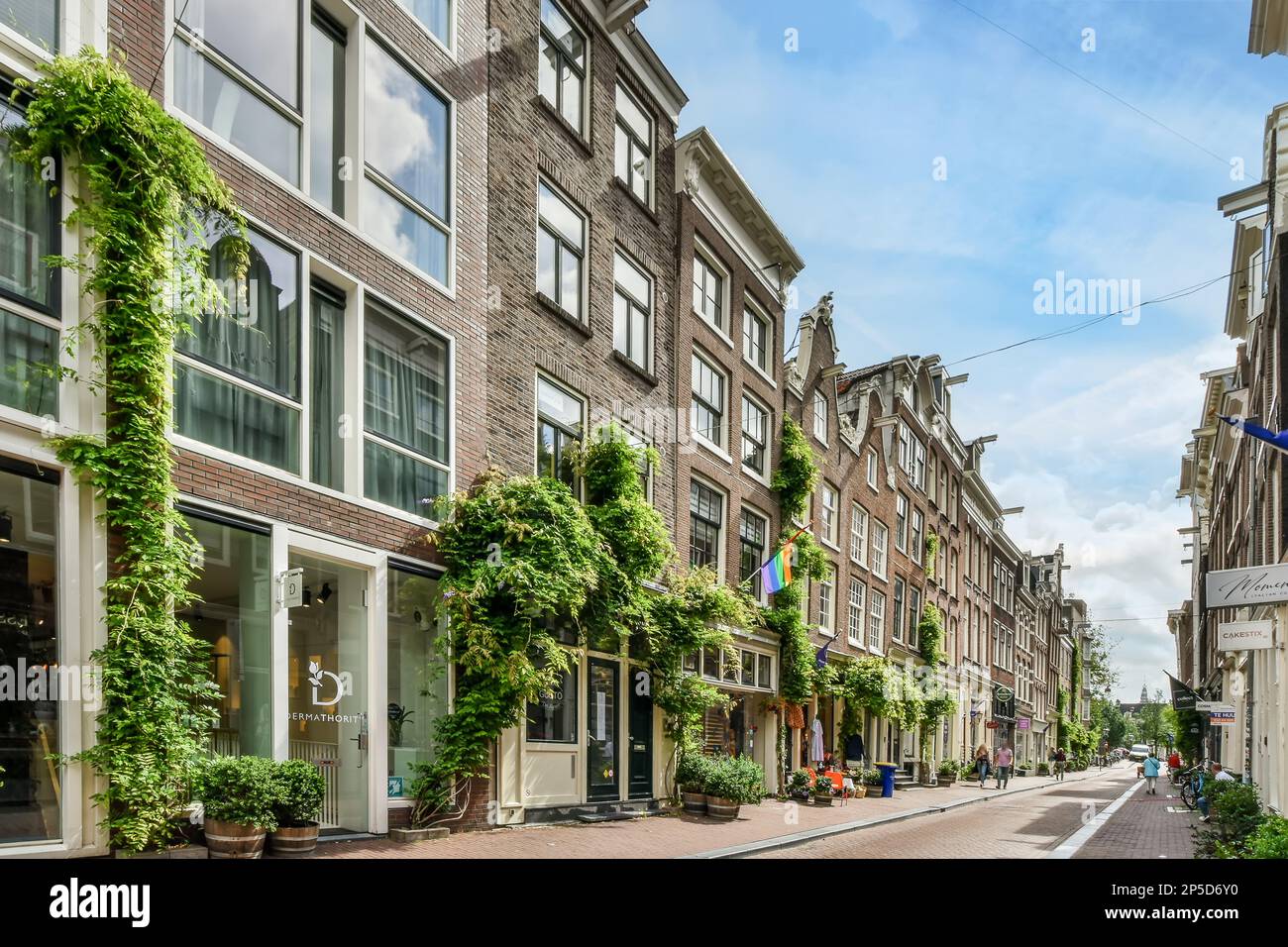 Amsterdam, Netherlands - 10 April, 2021: a city street with people ...