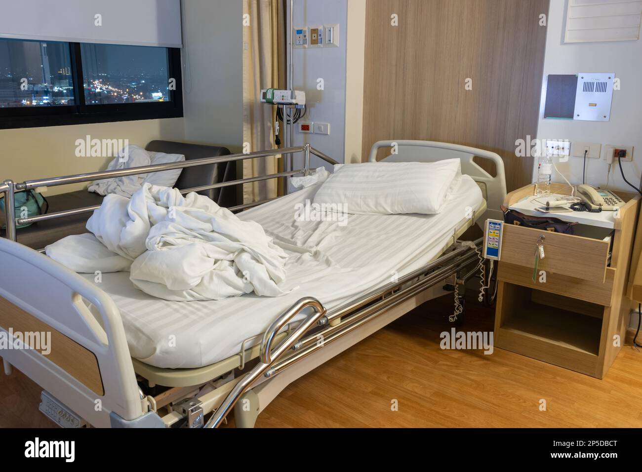 An abandoned hospital bed in a room occupied by a patient Stock Photo ...