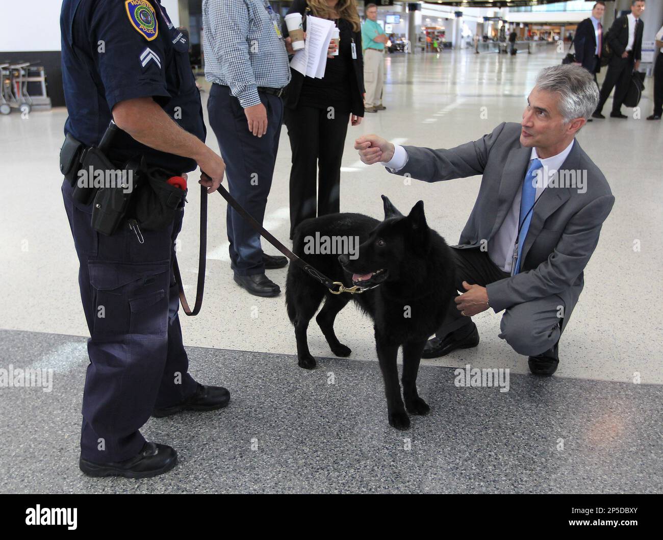 United's Jeff Smisek chats with Yori the drug dog at gate E7 at Bush ...