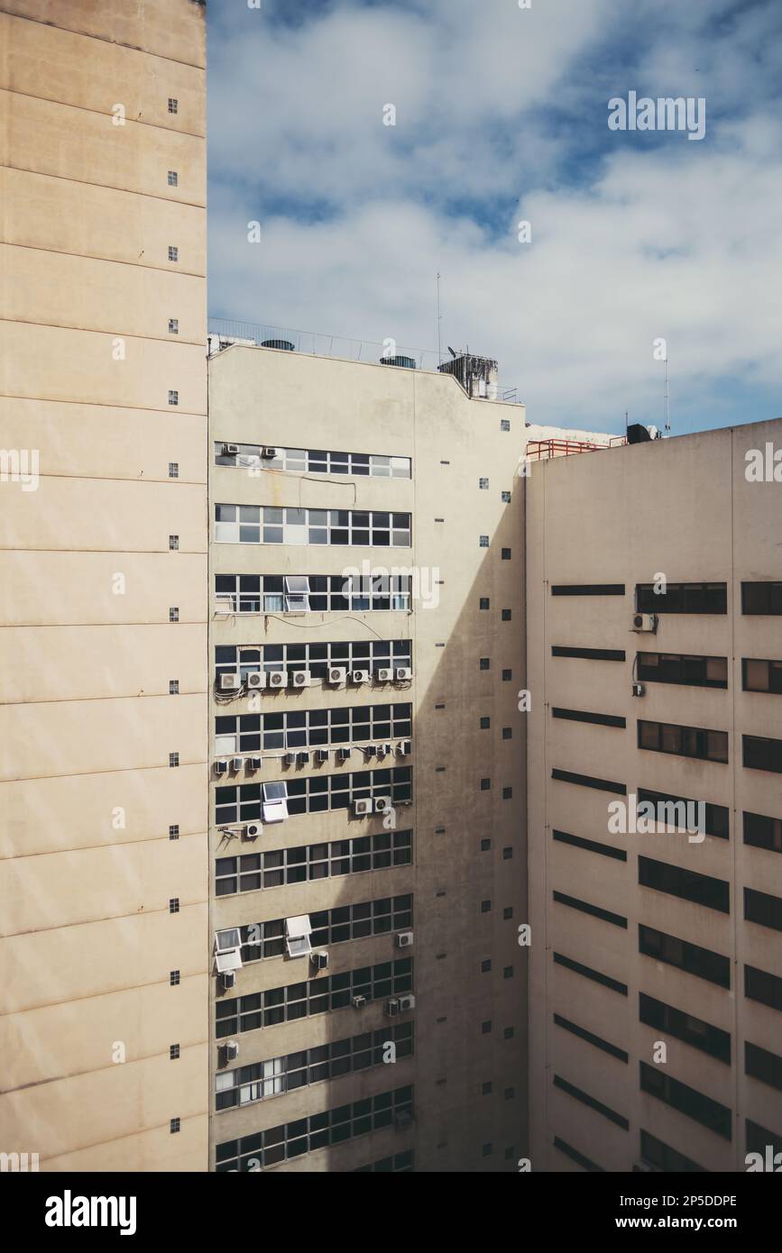 A vertical capture of an inner corner of two yellow-to-cream-colored ...