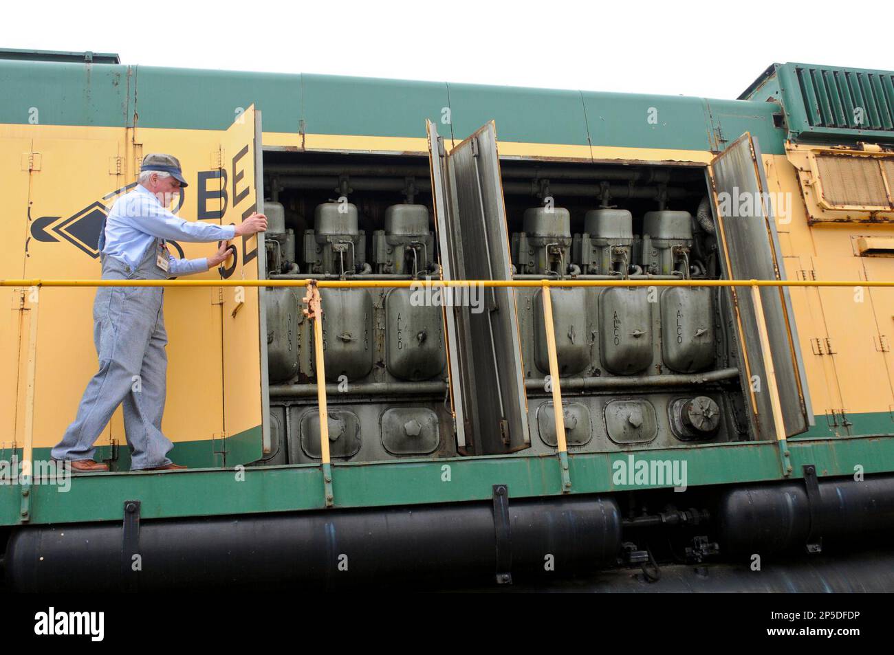 Dale Woodland, director of museum operations, closes part of the doors ...