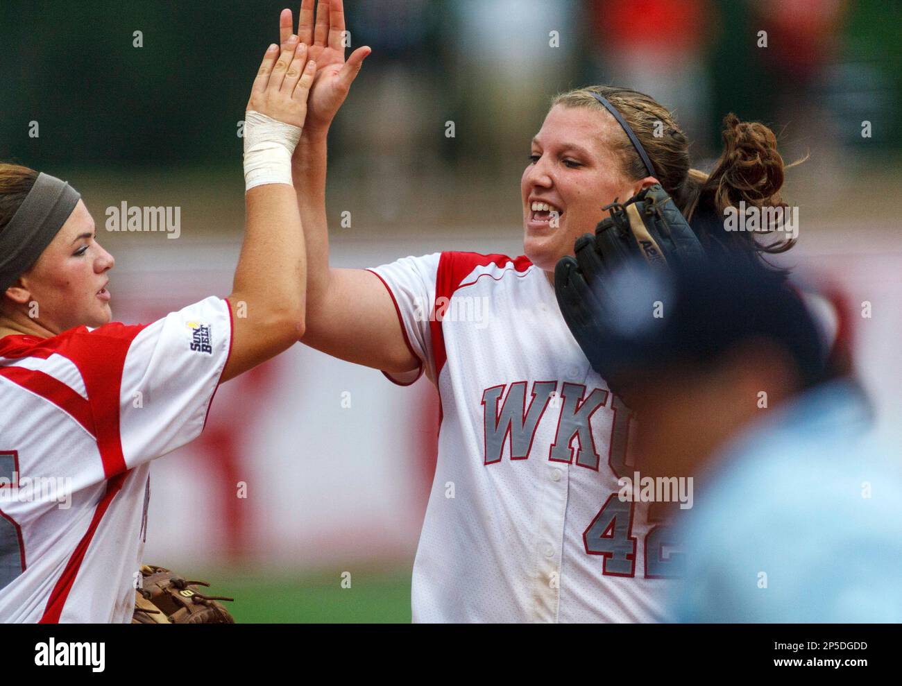 Western Kentucky's Preslie Cruce, left, high-fives Emily Rousseau after ...