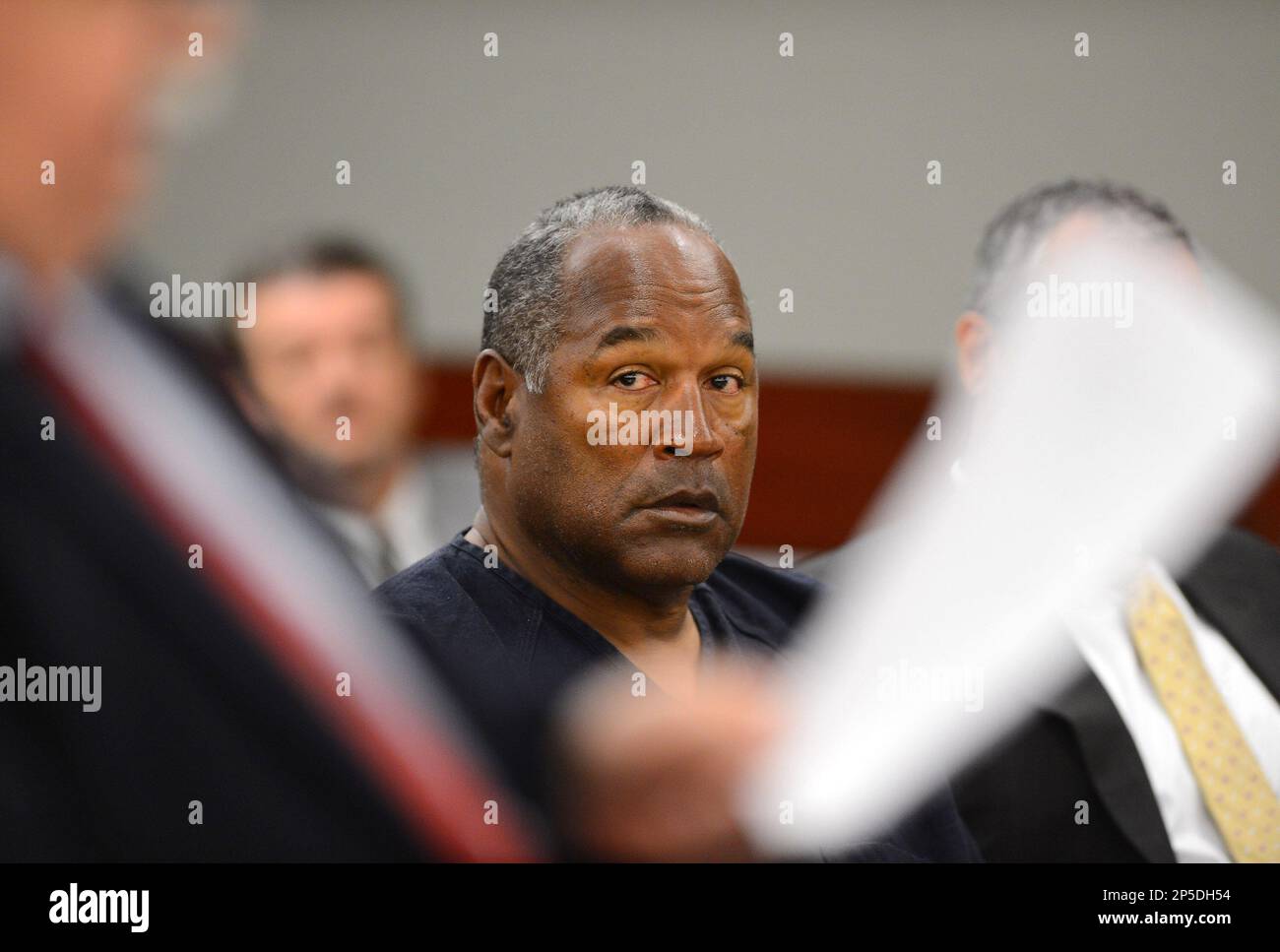 O.J. Simpson looks over at his lawyer Tom Pitaro during an evidentiary ...