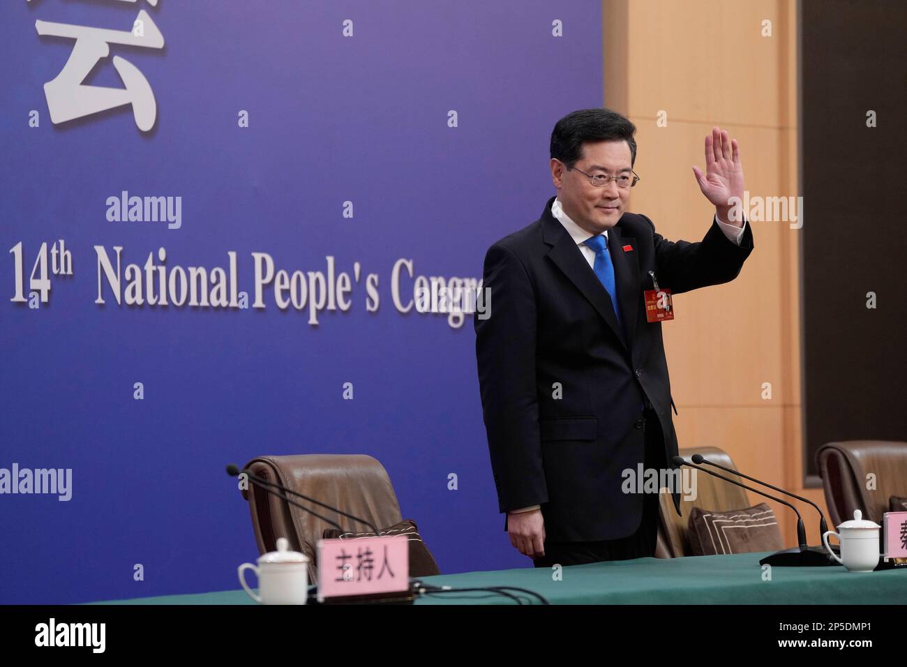 Chinese Foreign Minister Qin Gang waves as he arrives for a press ...