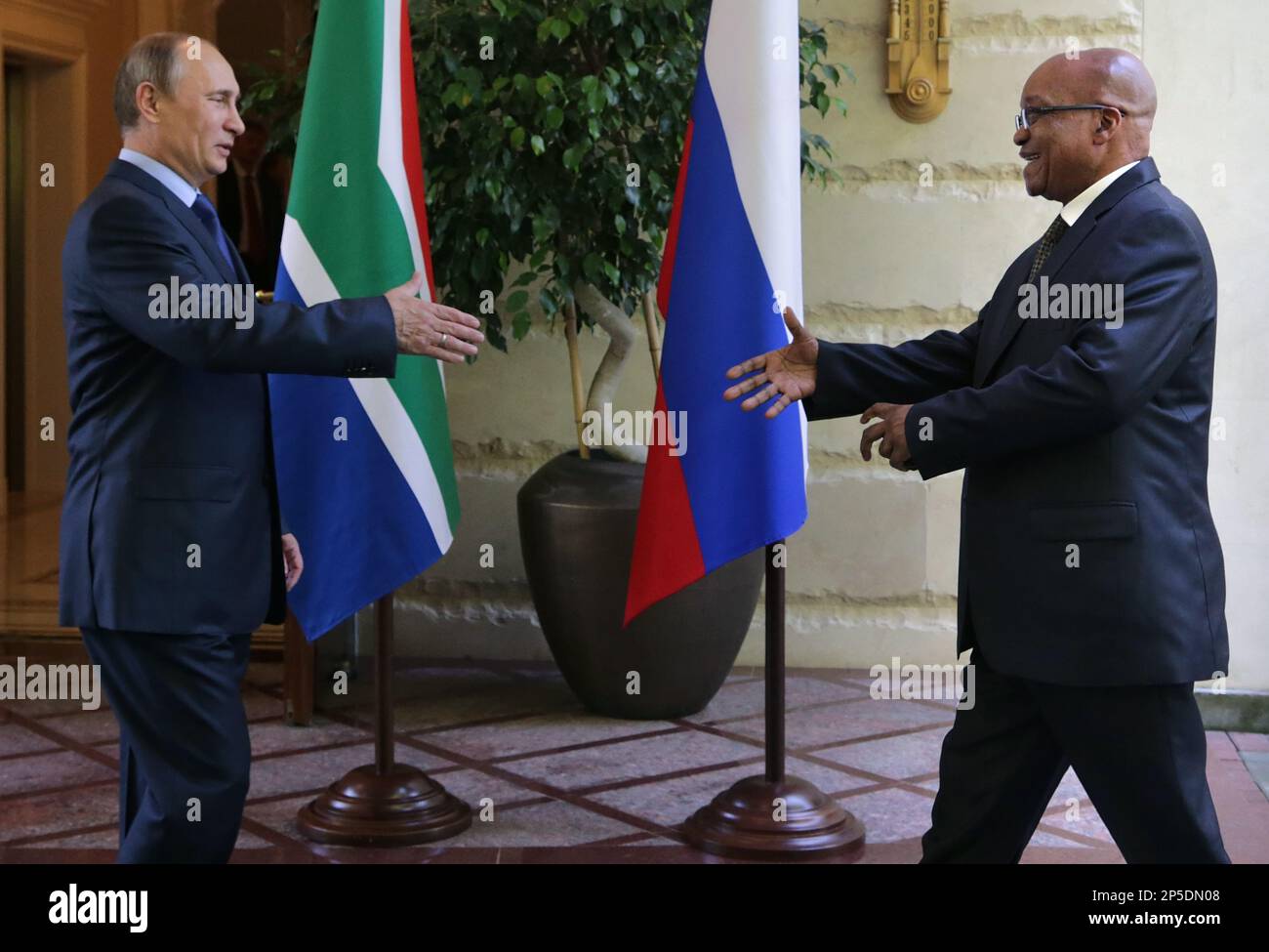 Russian President Vladimir Putin, left, greets South African President ...