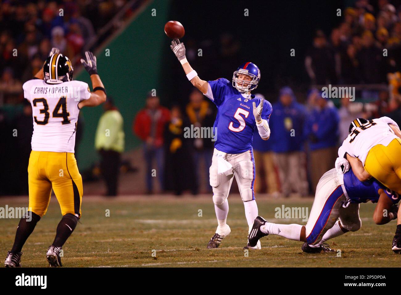 Todd Reesing #5 of the Kansas Jayhawks throws a pass against the ...