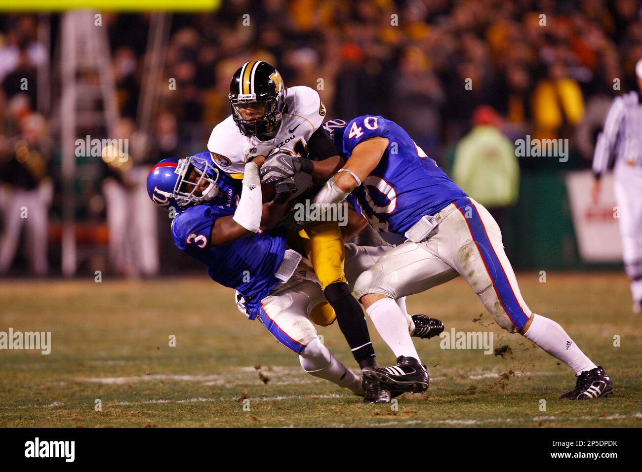 Danario Alexander #81 of the Missouri Tigers is tackled by Aqub Talib ...
