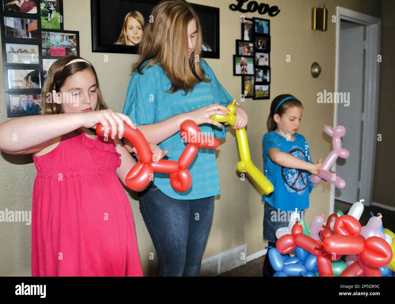 In this May 8, 2013, photo from left, Kylee, Erin and Madison Stirens ...