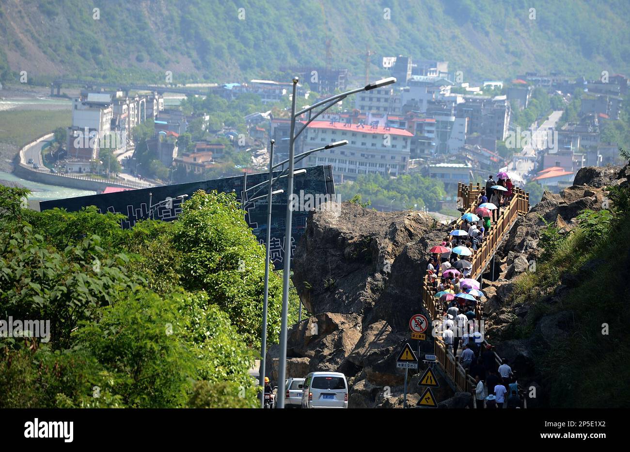 In this Sunday May 12, 2013 photo, tourists visit the old Beichuan ...