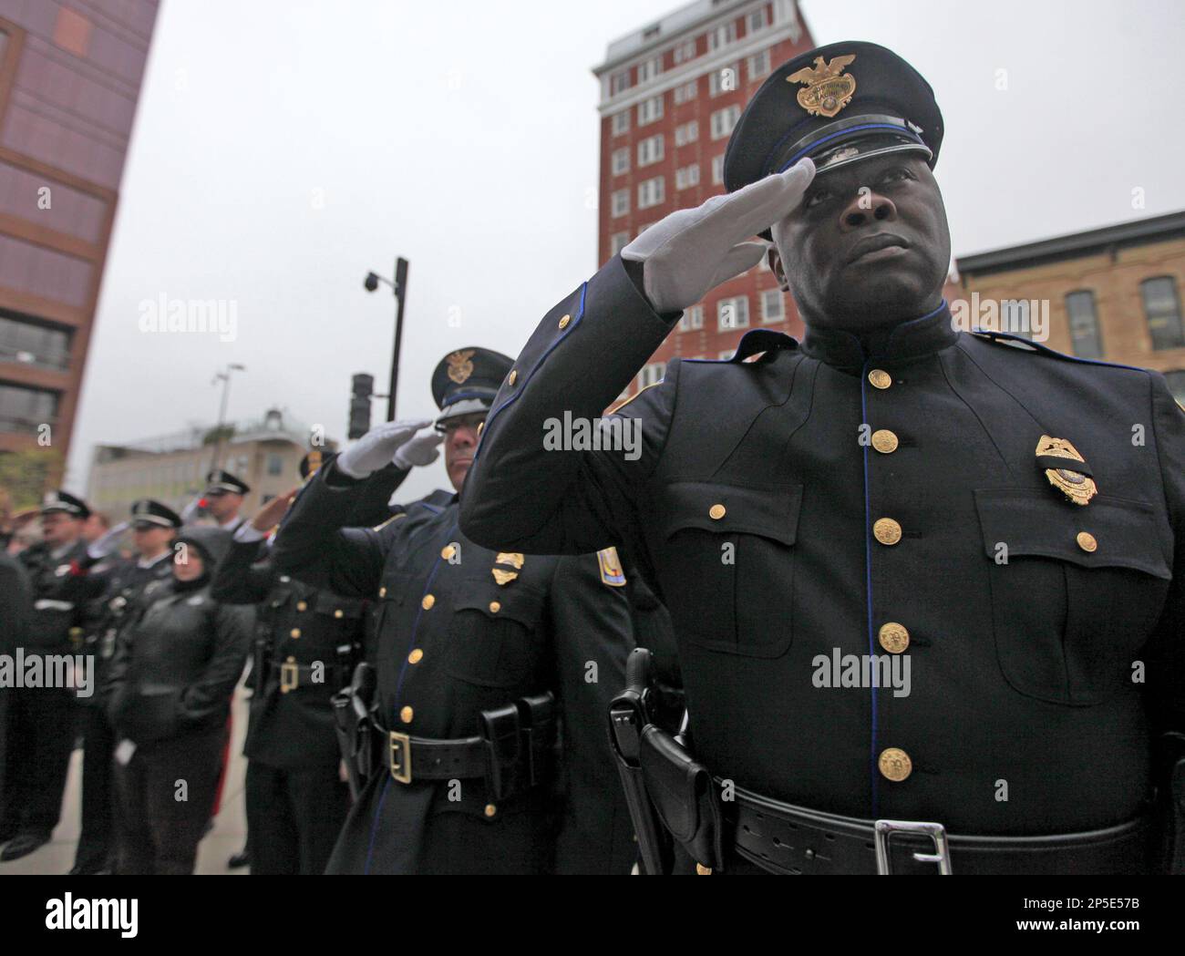 City of Racine, Wis. police officer Frederick Hyatt salutes during the ...