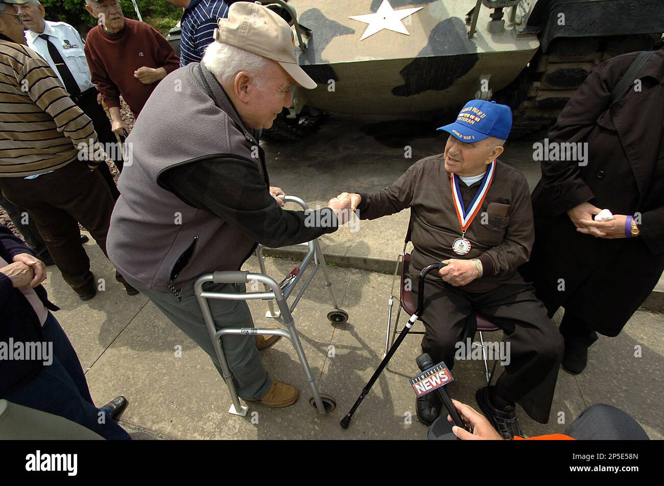 World War II Veteran Joseph Gambo, 90, of Dunmore, Pa. right, is ...
