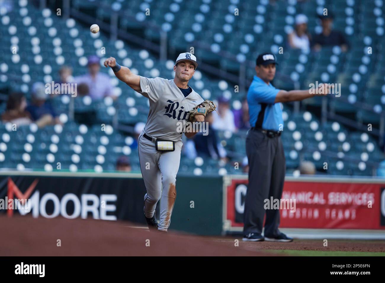 Rice Owls third baseman Jack Riedel (15) makes a throw to first against ...