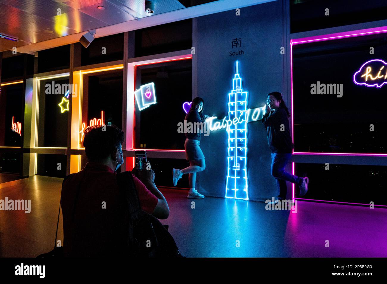 Taipei, Taiwan, 06/03/2023, People pose for a photo together in front ...