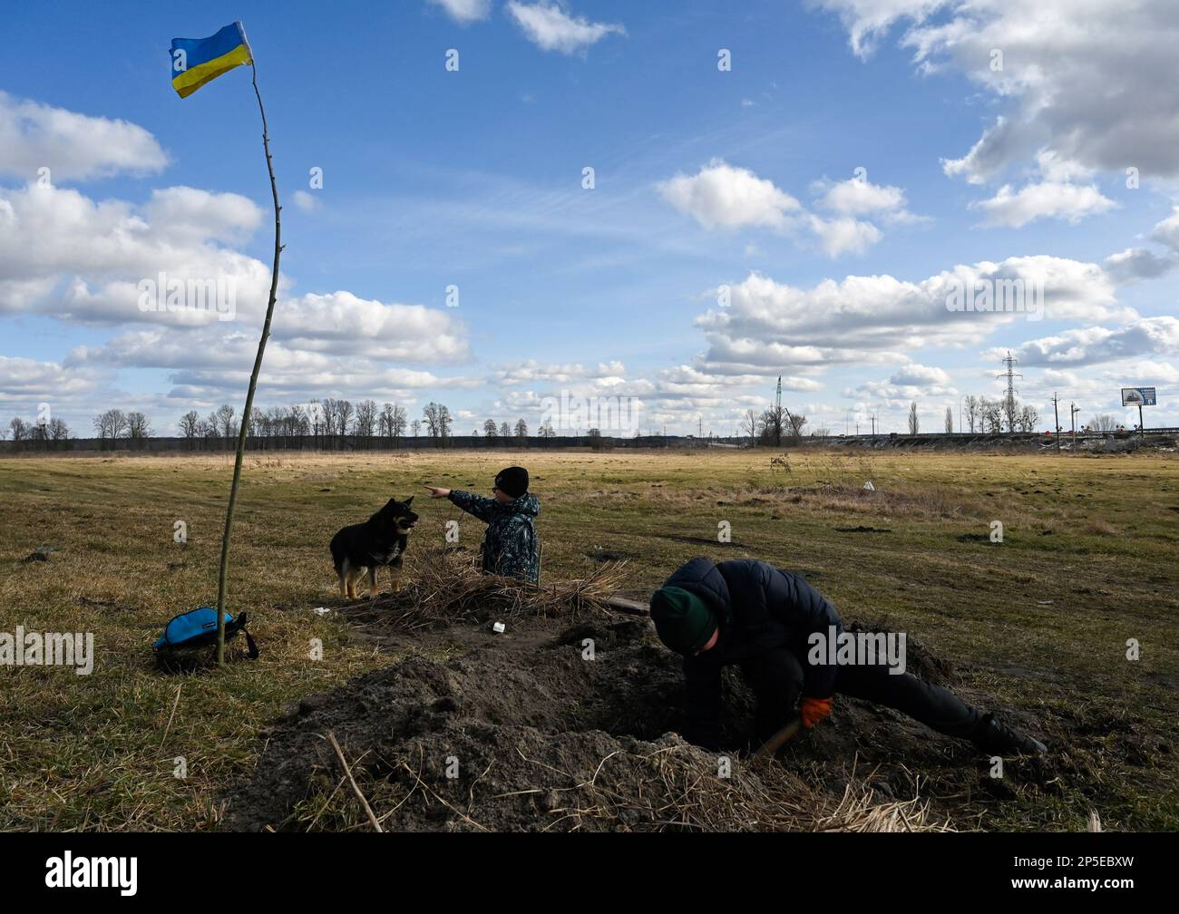 Ukrainian children dig a trench as they play war in Borodyanka ...