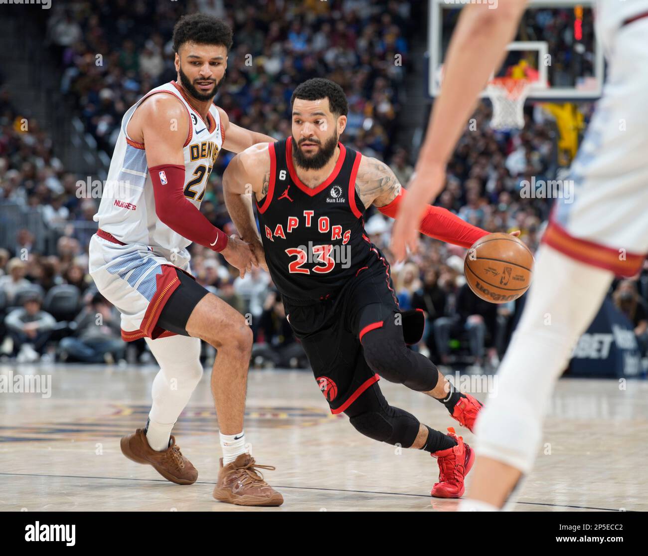 Toronto Raptors guard Fred VanVleet, right, drives past Denver Nuggets ...