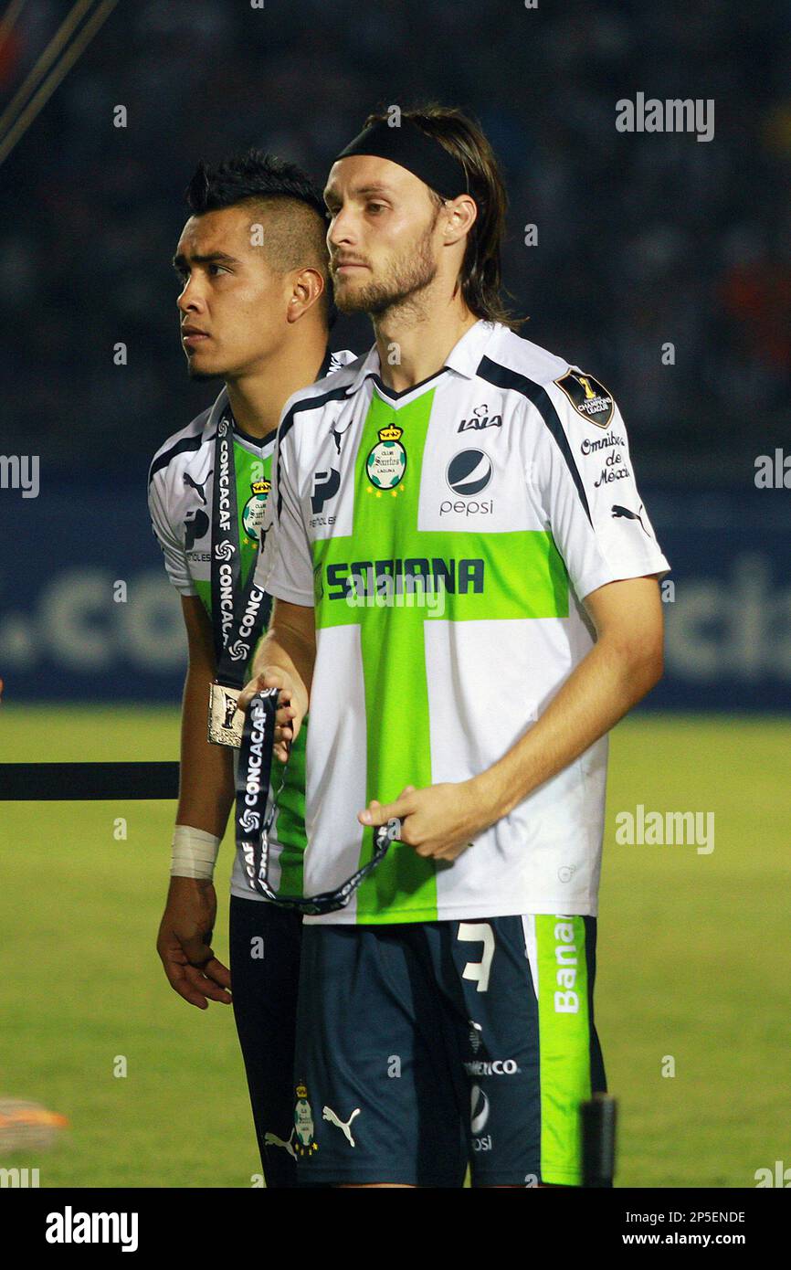 Santos Laguna's Mario Cardenas, left, and Edgar Gerardo Lugo stand in ...