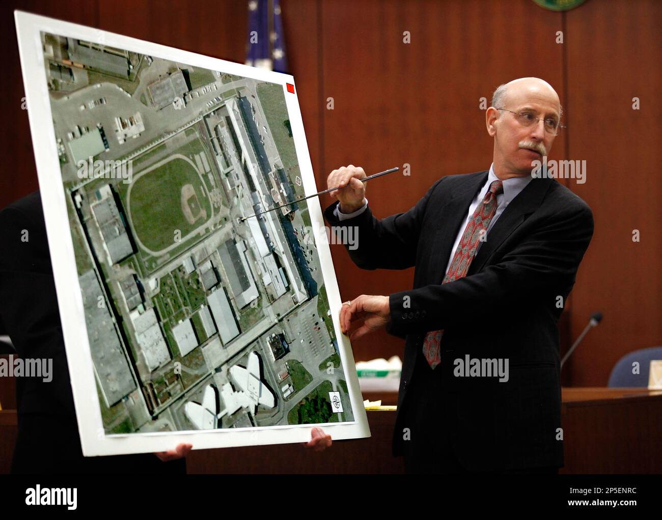 Snohomish County Prosecuting Attorney Mark Roe displays a large aerial ...
