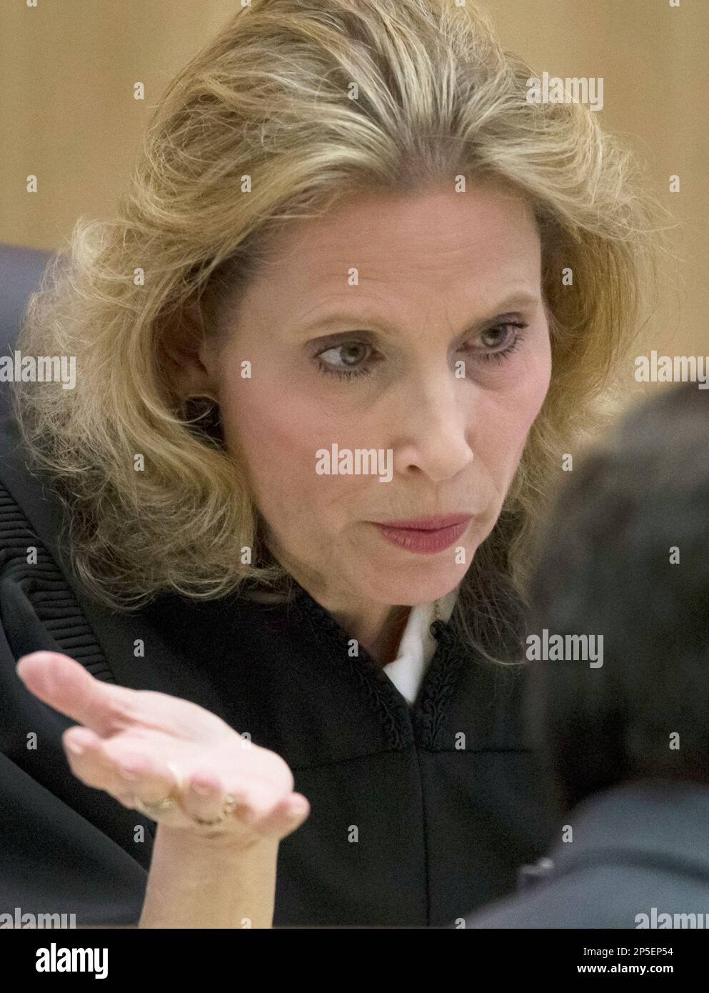 Judge Sherry Stephens talks with prosecutor Juan Martinez during the ...