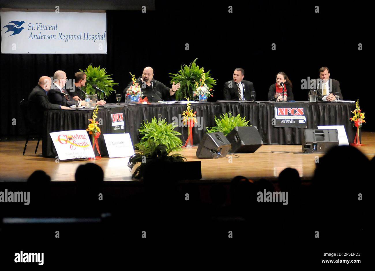 Gary Brummitt, center, moderates the third of three community ...