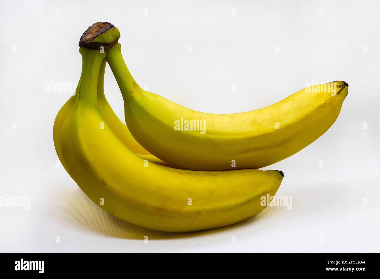 banana bunch placed on white background Stock Photo - Alamy