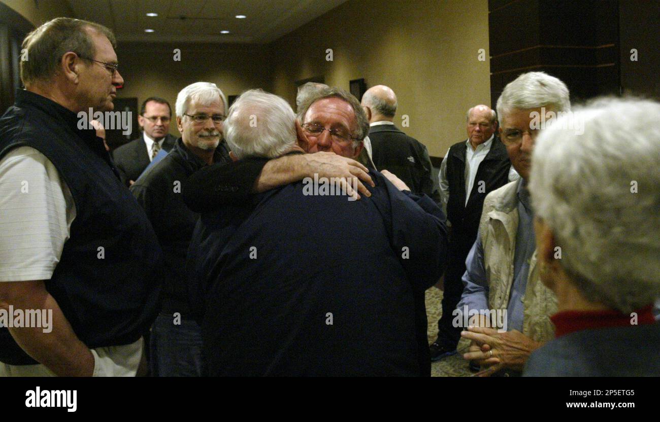 The Rev. Bill Langlois St. Patrick's Catholic Church receives a hug of ...