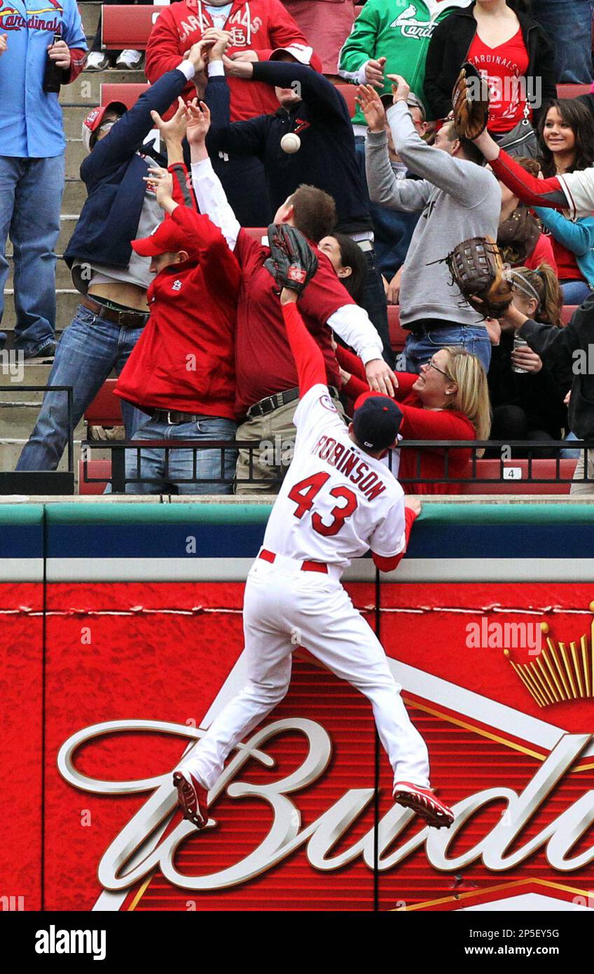 St. Louis Cardinals center fielder Shane Robinson scales the center ...