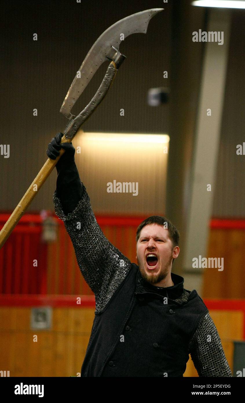 In this April 20, 2013 photo, Mike Davis cheers after winning a melee ...