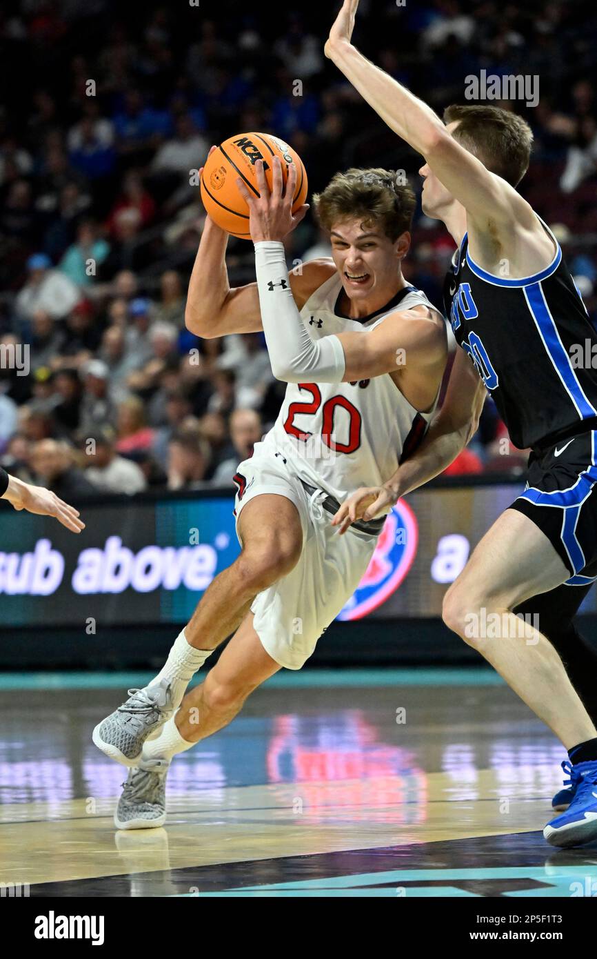 Saint Mary's guard Aidan Mahaney (20) drives the ball against BYU ...