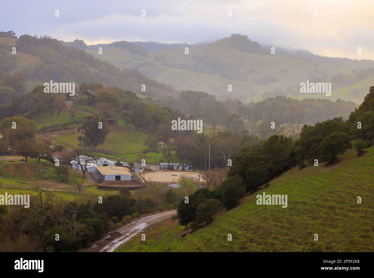 Farmhouse on ranch in rolling green hills of Northern California in ...